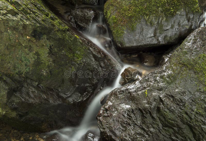 Cascade falls with rocks stock photo. Image of fresh - 57971004
