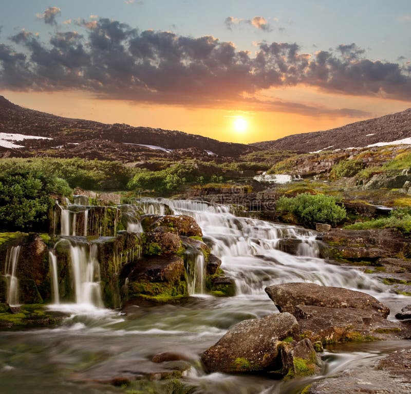 The Cascade of Falls on a Sunset in Mountains Stock Photo - Image of ...