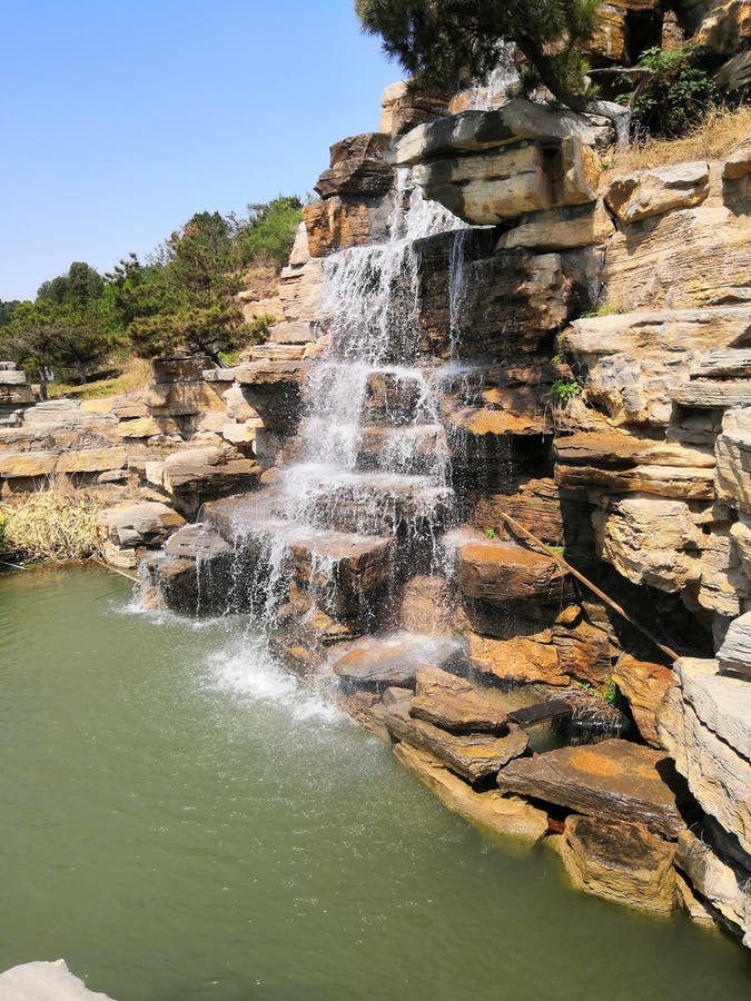 Cascade and Stone in the Suburbs Stock Image - Image of stone, cascade ...