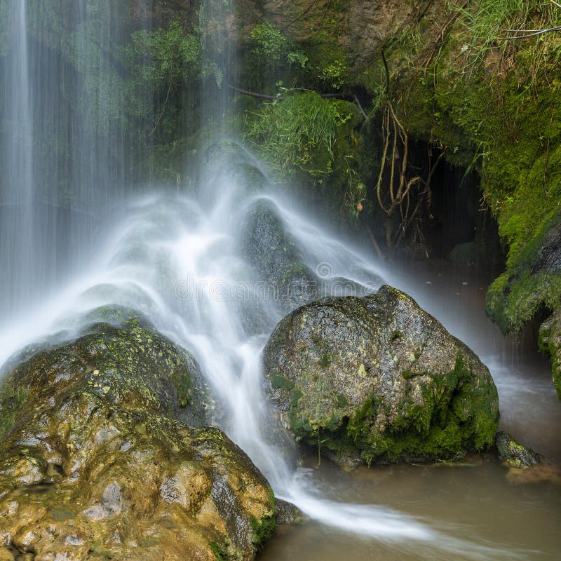 Cascade Streaming on Green Rocks Stock Photo - Image of beautiful ...