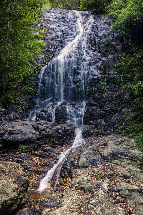 A Cascade Waterfall Flowing Over Patterned Rocks in a Temperate ...
