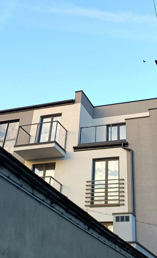 Cascading Building with Windows that Reflect Clouds Stock Image - Image ...