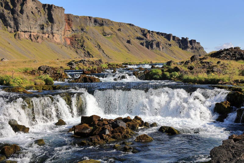 Cascading Stream of Pristine Water Flows Around Large Rocks in a ...