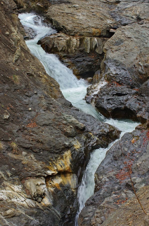 Cascading Stream between Rocks 2 Stock Image - Image of blur, mountains ...