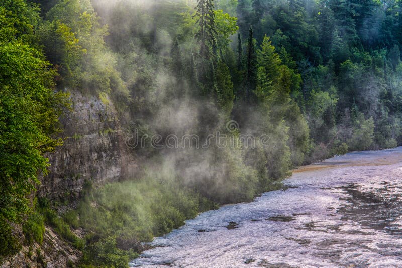 Cascading Water and Mist stock photo. Image of tahquamenon - 100275630