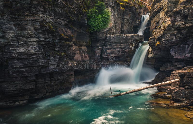 Cascading Waterfalls Flowing into a River. Stock Image - Image of green ...