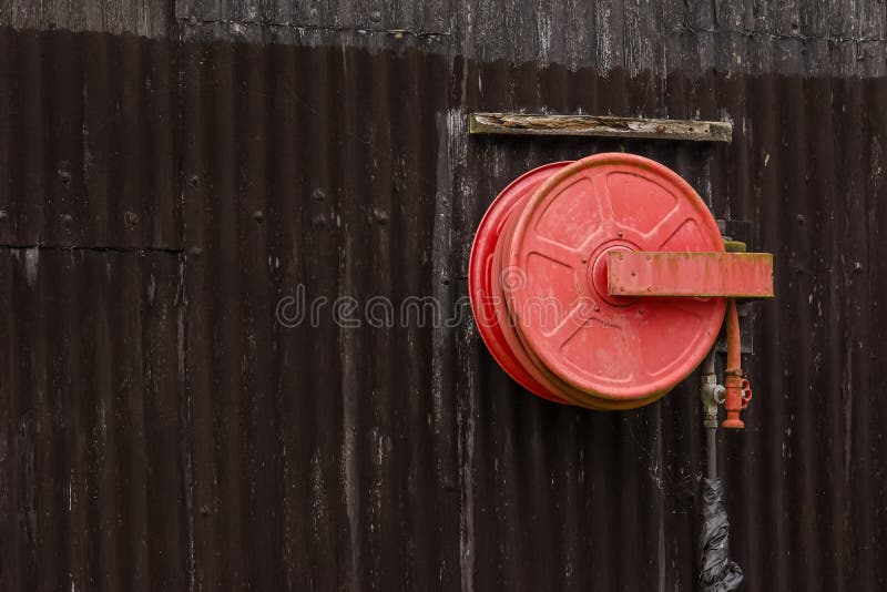 In Case of Fire Pull the Red Hose Stock Photo - Image of house, wound ...