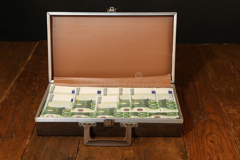 Case Full of Money Standing on the Table. Stock Image - Image of ...