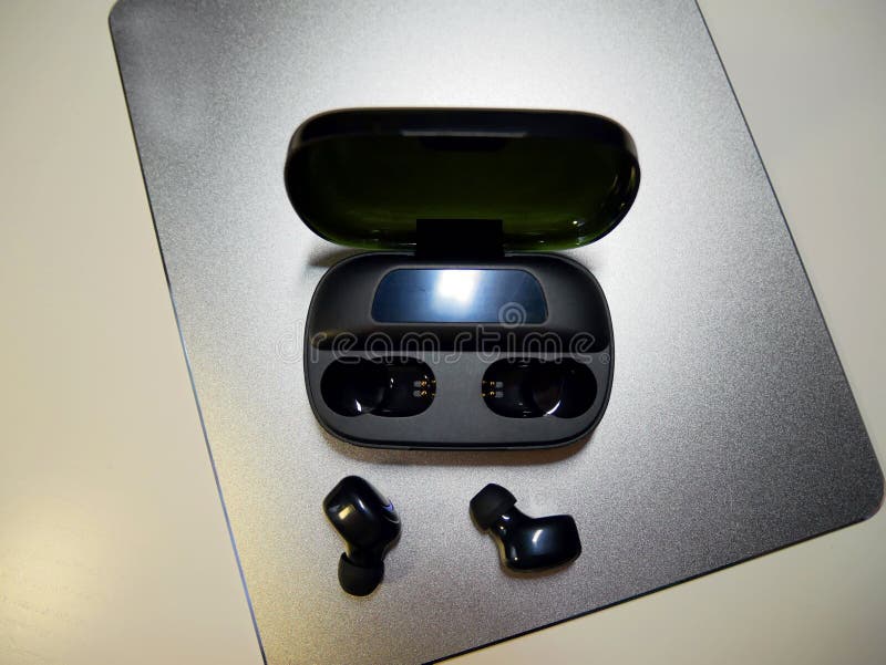 The Case of TWS Headphones is Made of Black. Black Wireless Headphones ...