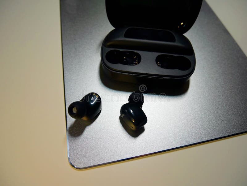 The Case of TWS Headphones is Made of Black. Black Wireless Headphones ...