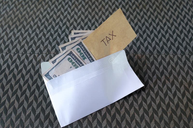 Cash Dollars Money in Envelope with Note TAX Stock Photo - Image of ...