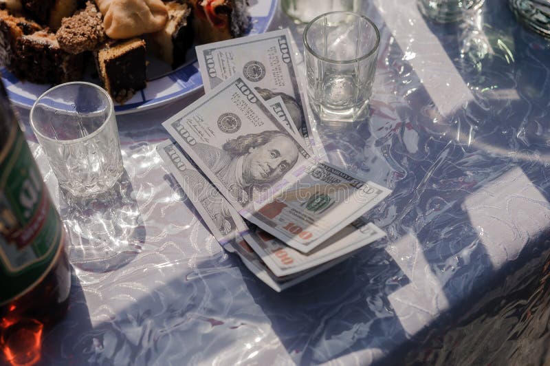 Cash on a Festive Table Surrounded by Snacks and Drinks Stock Image ...