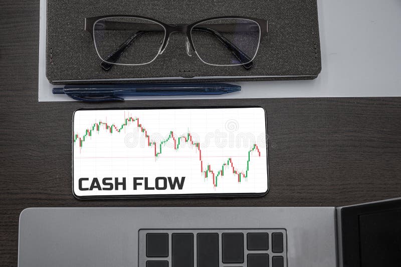 Cash flow text in phone stock image. Image of credit - 258146759