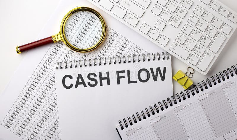 CASH FLOW Text Written on a Notebook on Chart with Keyboard and ...