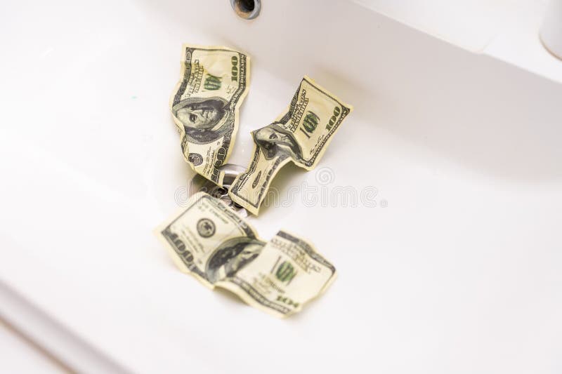 Cash Money Going Down Sink Drain Isolated on White Background Stock ...