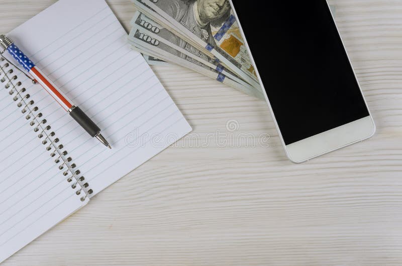 Cash Payment Record with Notebook, Dollar Bill and Phone Stock Photo ...