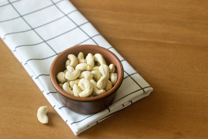 Cashew in a Clay Bowl on a Wooden Table Stock Image - Image of plant ...