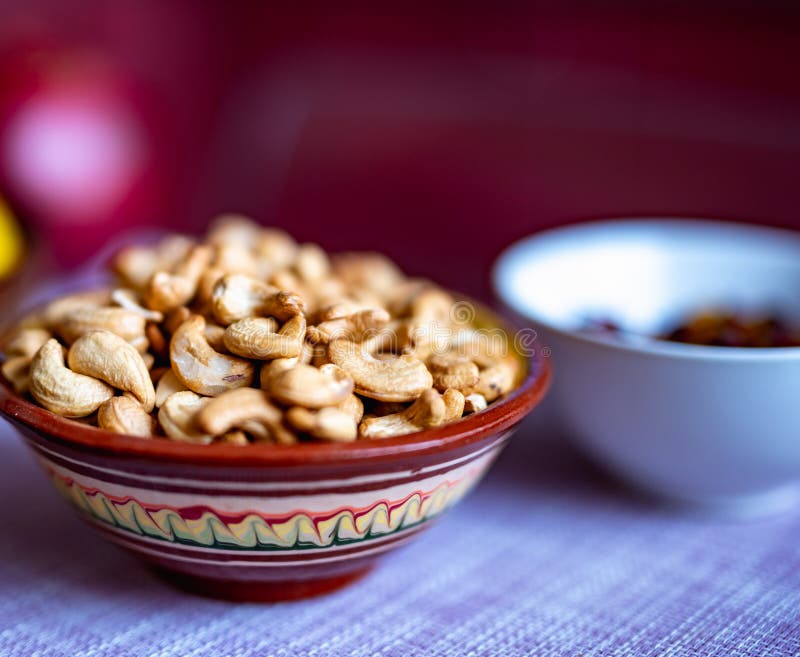 Cashew nuts with a bowl stock photo. Image of dried - 239205204
