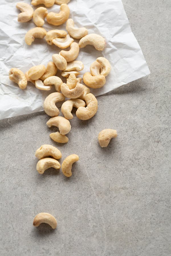 Cashew nuts on white paper stock image. Image of roasted - 180083951