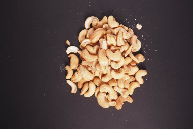 Cashews Arranged on a Dark Surface Showcasing Their Texture and Color ...