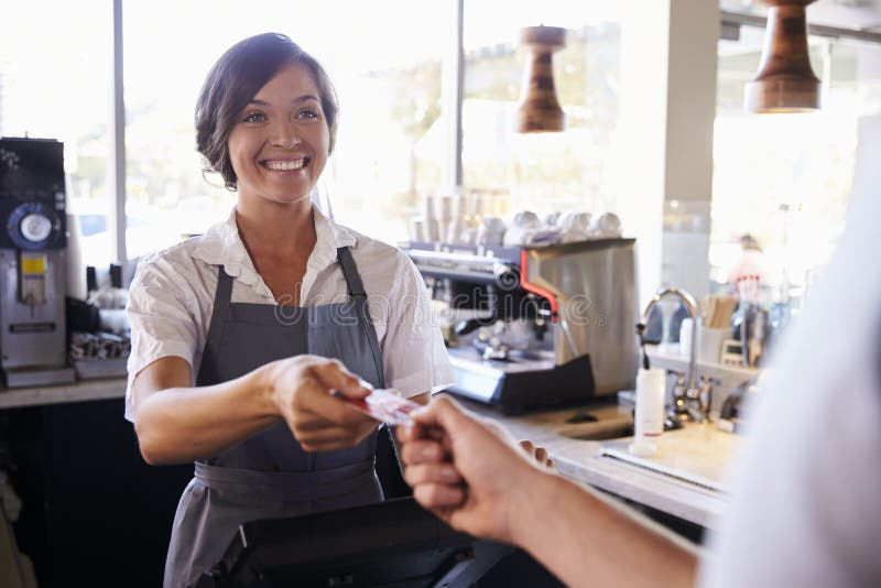 Cashier Accepts Card Payment from Customer in Delicatessen Stock Image ...