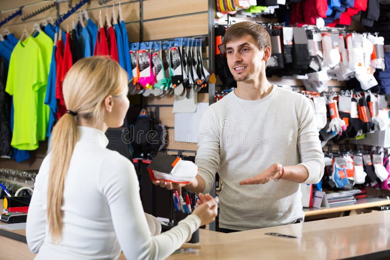 Cashier Helping Customer at the Pay Desk Stock Image - Image of ...