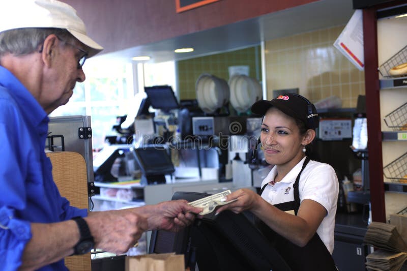 Cashier Takes Money Editorial Stock Image - Image: 21524369