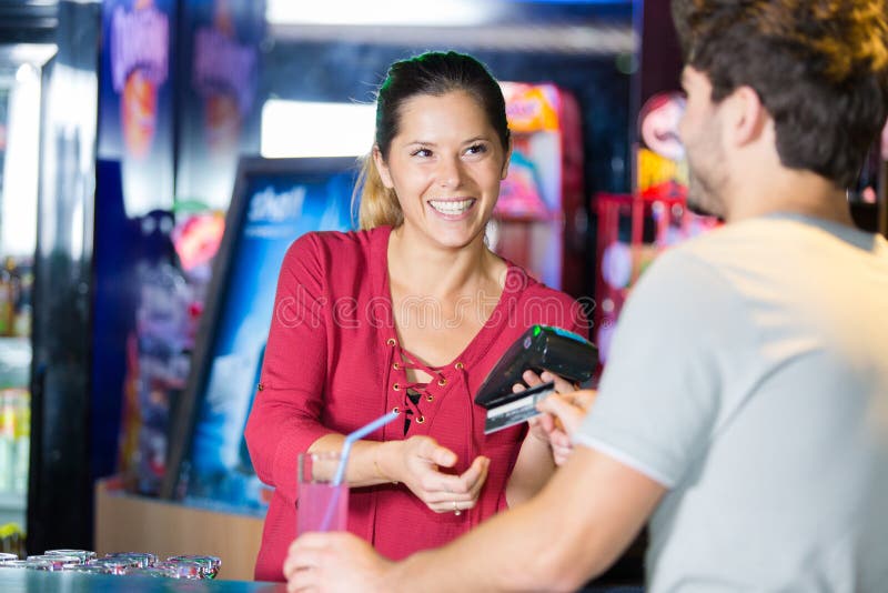 Cashier Using Credit Card Reader To Accept Payment Stock Image - Image ...
