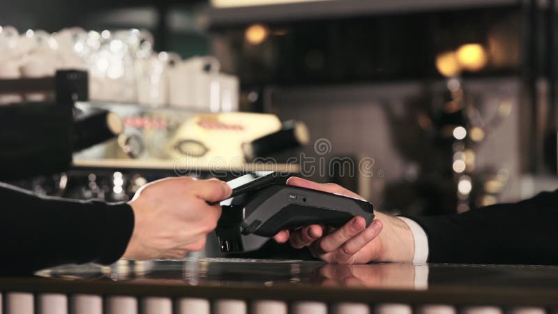 Cashless Payment at Bar Using Terminal and Smartphone Stock Footage ...