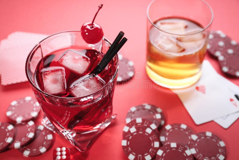 Casino Chips, Dice, Playing Cards and Alcohol Drinks on Red Table ...