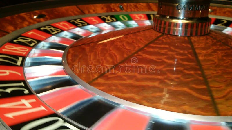 Casino Roulette in Motion with Spinning Wheel and Ball. the Croupier ...