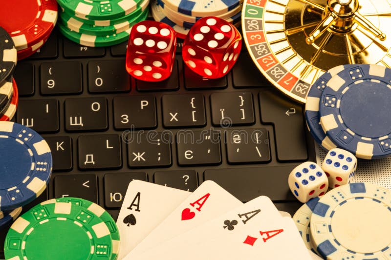 A Casino Setting with Playing Cards, Dice, and Roulette Wheel, Depicted ...