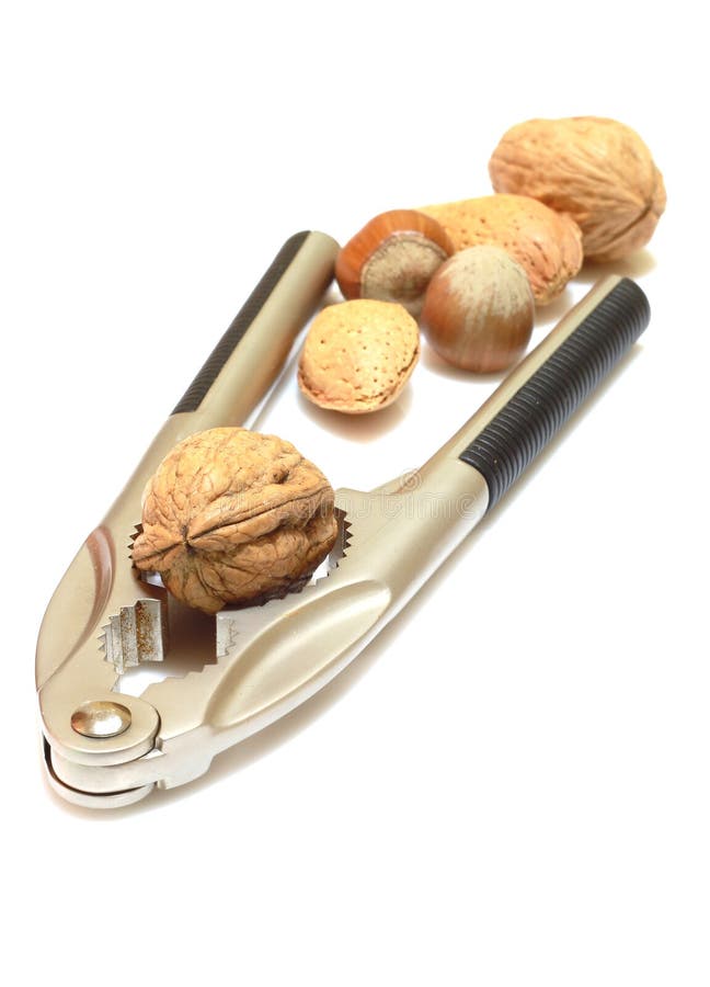 Casse-noix avec des noix image stock. Image du rupture - 12503665