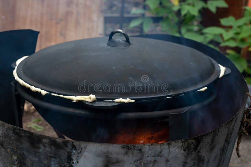 Cast Iron Cauldron for Cooking is on the Fire in the Open Air Stock ...
