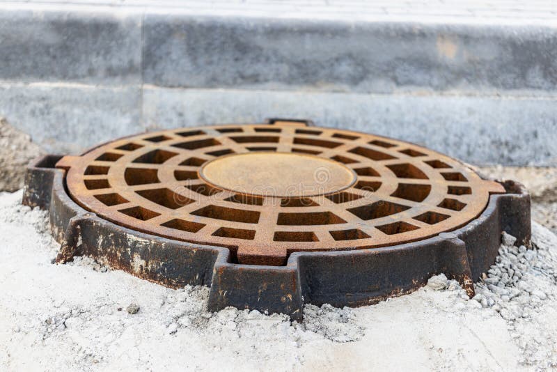 New Cast Iron Manholes Prepared for Installation at the Construction ...