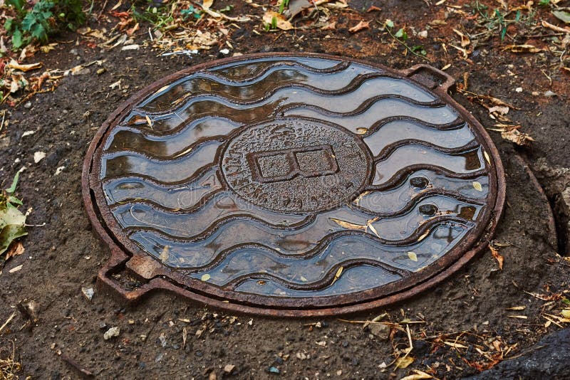 Cast Iron Manhole from the Well. Stock Photo - Image of accessibility ...