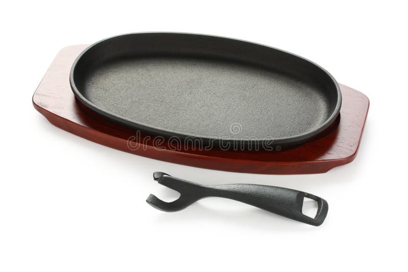 Cast Iron Sizzling Steak Plate Stock Photo - Image of stand, lifting ...