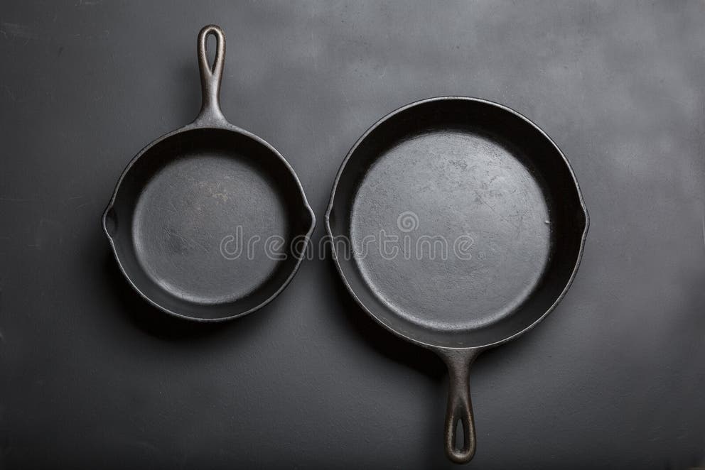 Cast Iron Skillet Stacked Side by Side Stock Photo - Image of single ...
