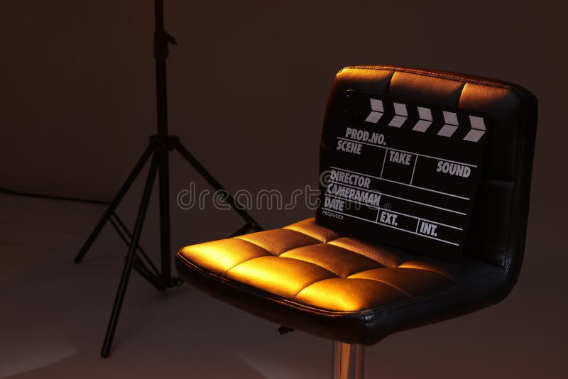 Casting Call. Chair and Clapperboard in Modern Studio, Closeup. Space ...