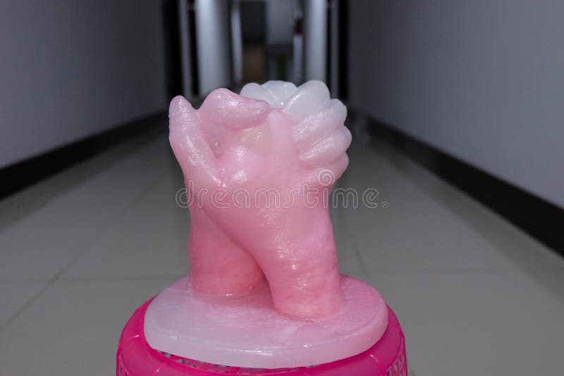 Casting Resin Model on Two Young Lovers Holding Hands Stock Image ...