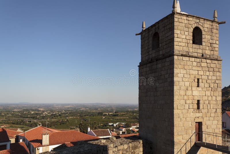 Castle Bell Tower with Village in the Background Stock Image - Image of ...