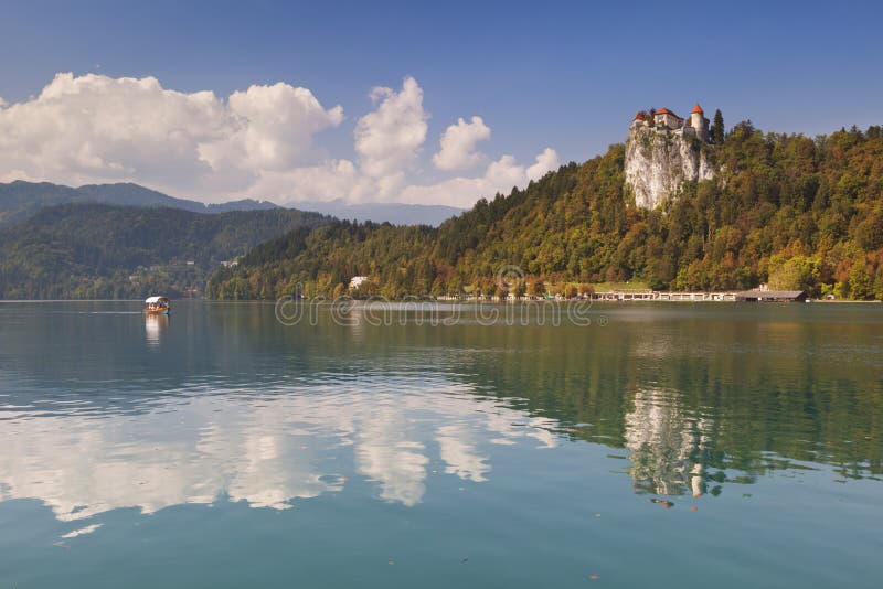 The Castle of Bled Reflected in Lake Bled, Slovenia Stock Image - Image ...