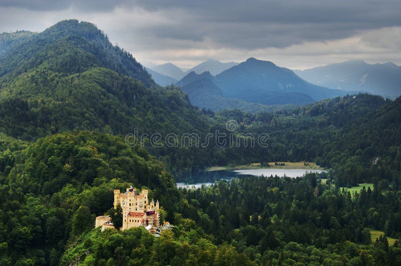 Castle by Lake in Forest Mountain Peaks Editorial Photo - Image of ...