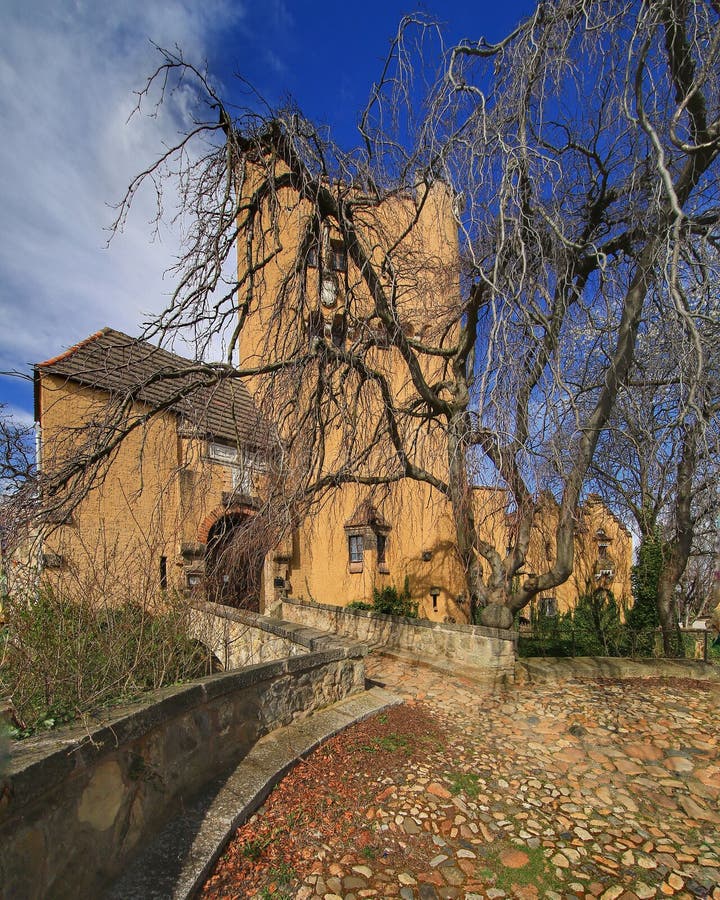 Castle Roseburg in Germany Behind Bare Trees and a Winding Cobblestone ...