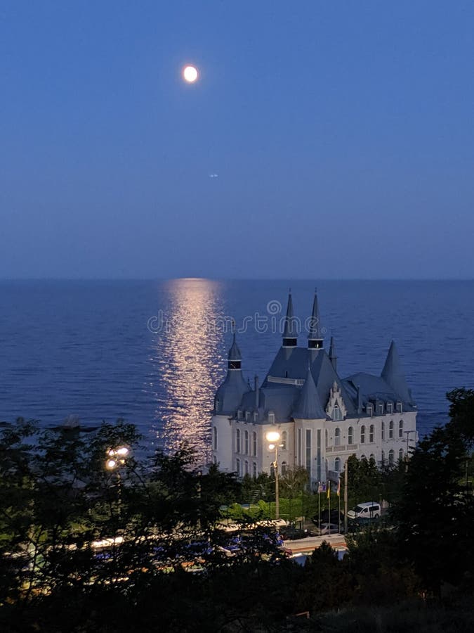 Odessa Castle with a Moon Path Stock Photo - Image of castle, skyline ...