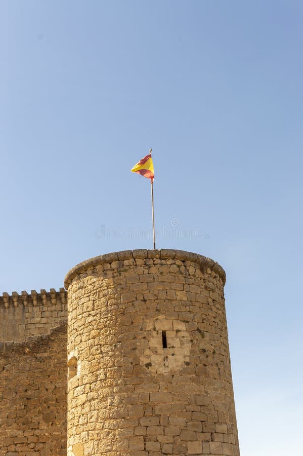 Castle Tower Built with Stone Blocks and the Spanish Flag Flying at the ...