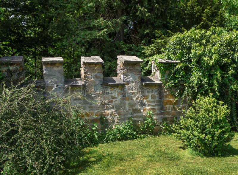 Castle Wall with Battlement in a Garden Stock Image - Image of ...