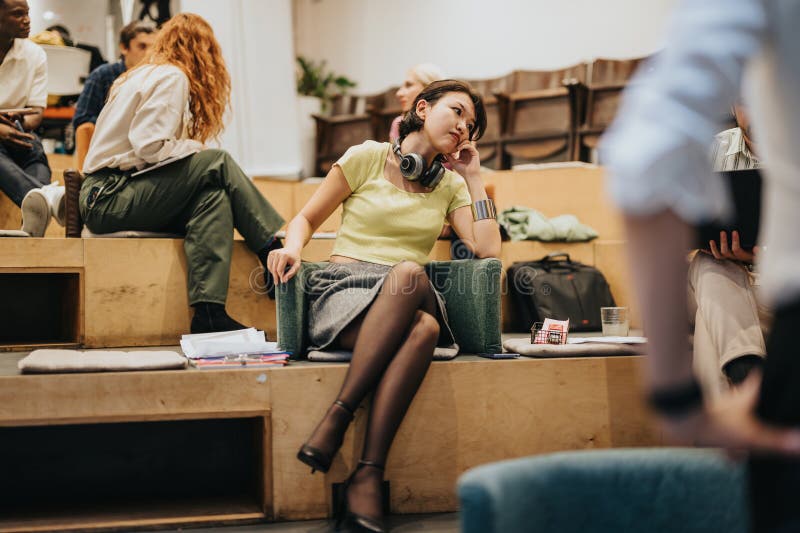 Casual Business Environment with People Collaborating and Relaxing in a ...