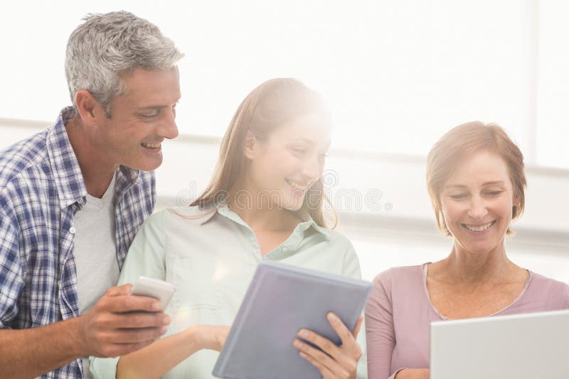 Casual Business People Using Electronic Devices Stock Photo - Image of ...