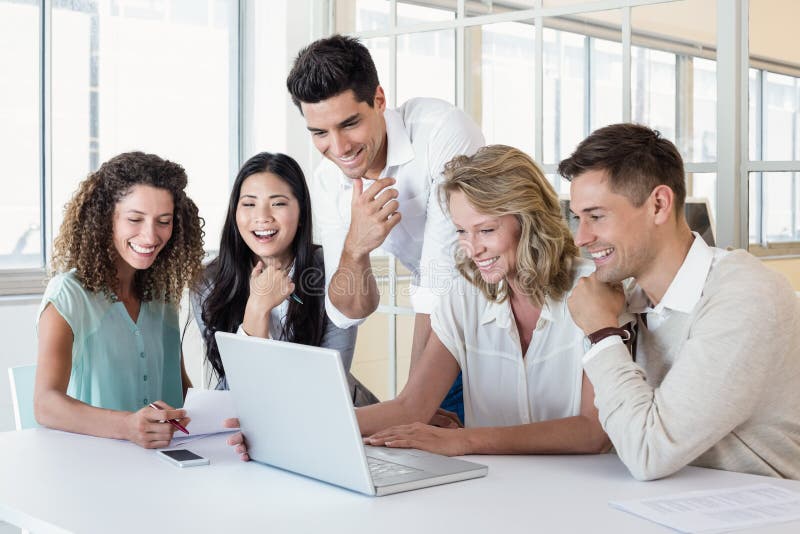 Casual Business Team Having a Meeting Using Laptop Stock Photo - Image ...
